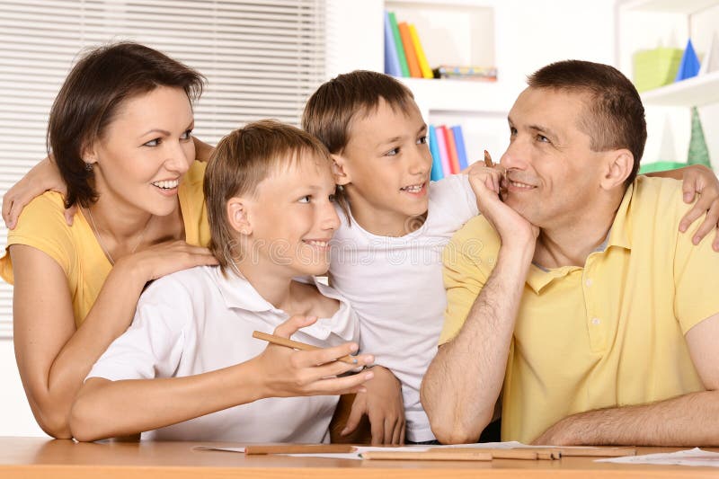 Parents help with homework stock photo. Image of boys - 46827188