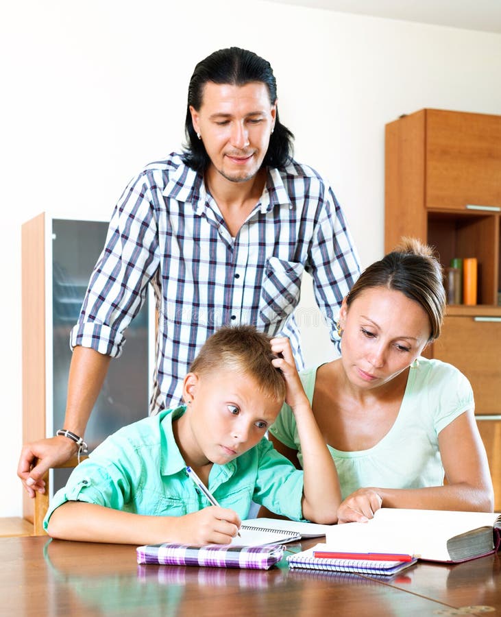 Parents Helping with Homework Stock Photo - Image of parent, female ...