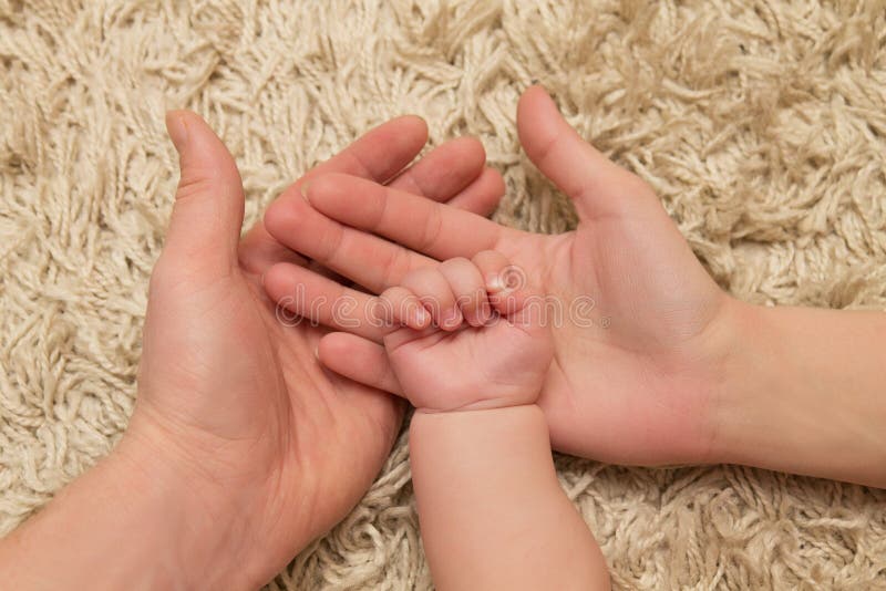 Parents Hold the Child S Hand Stock Photo - Image of concepts, babies ...