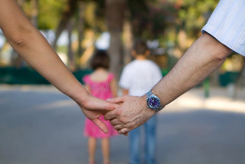 Parents Holding Hands with Kids in Front Stock Image - Image of kids ...