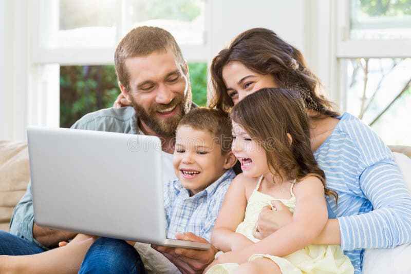 Parents and Kids Using Laptop in Living Room Stock Image - Image of ...