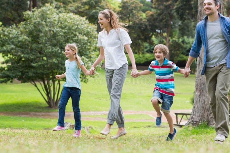 Mother and Two Young Children Walking on Path Stock Photo - Image of ...