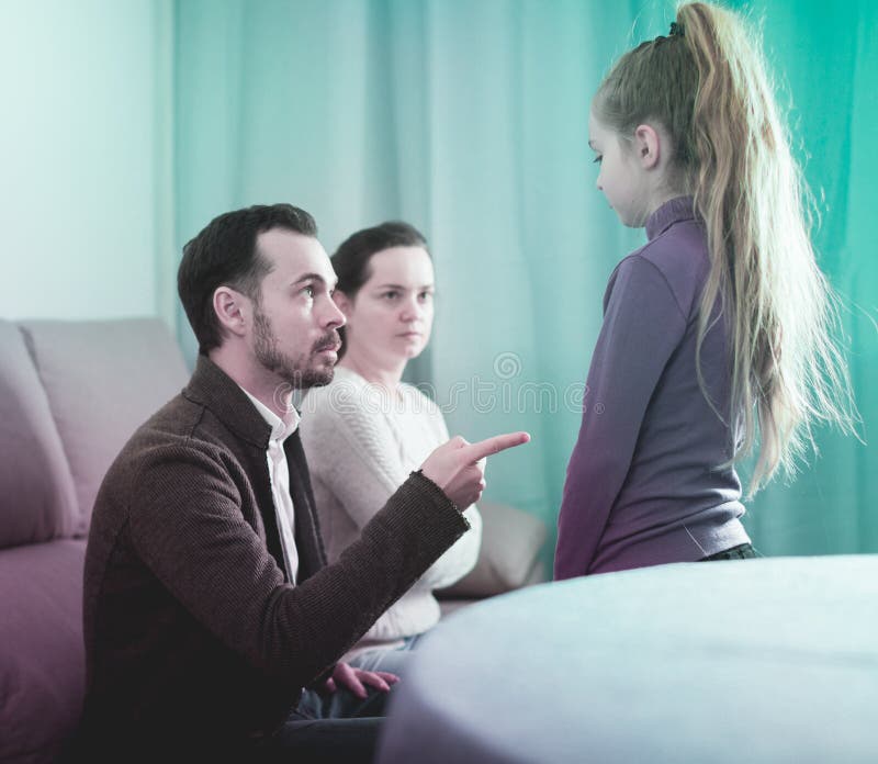 Parents lecturing daughter stock photo. Image of father - 88915132