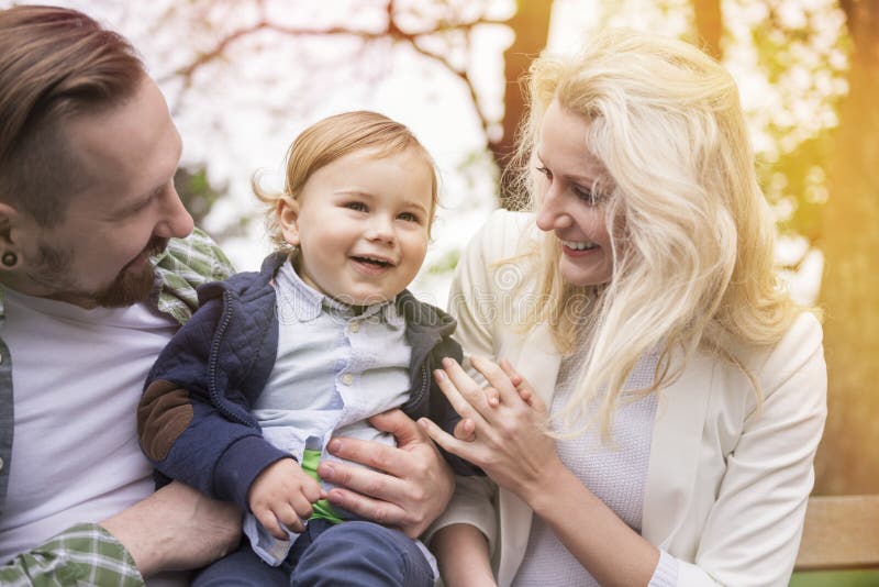 Parents with little boy stock photo. Image of enjoyment - 59075158