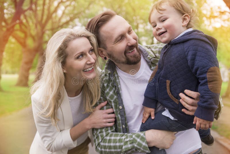 Parents with little boy stock photo. Image of nature - 59075016
