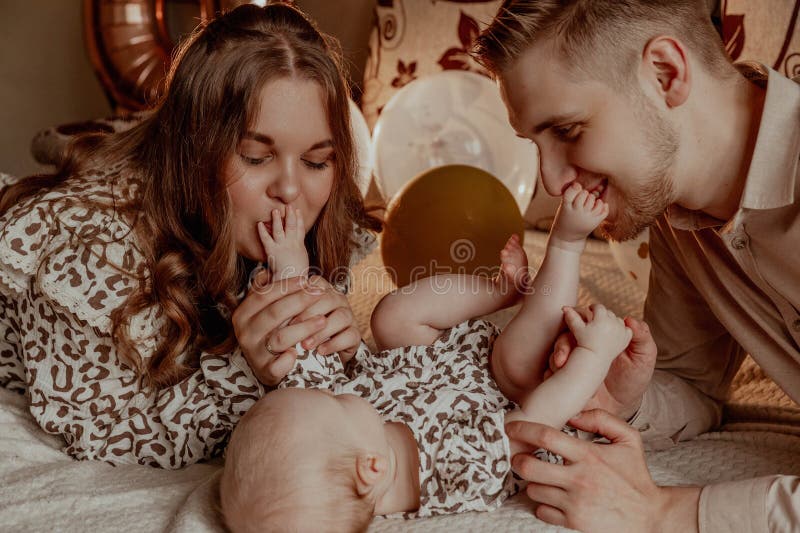 Parents, Mom and Dad with Little Baby on Bed Stock Photo - Image of ...