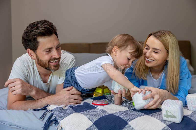 Parents Playing with Their Baby and Looking Happy Stock Image - Image ...