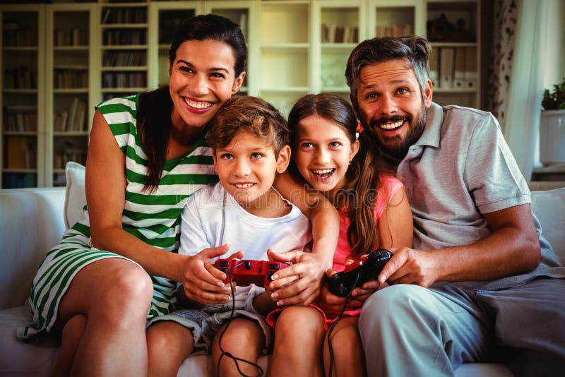 Parents Playing Video Games with Children Stock Photo - Image of ...
