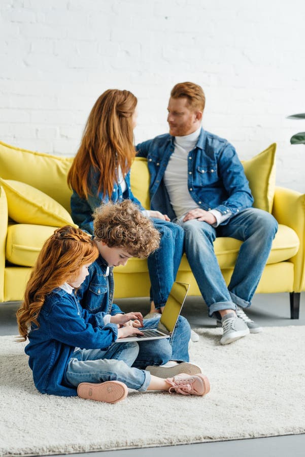 Parents talking while kids stock image. Image of handsome - 129328799