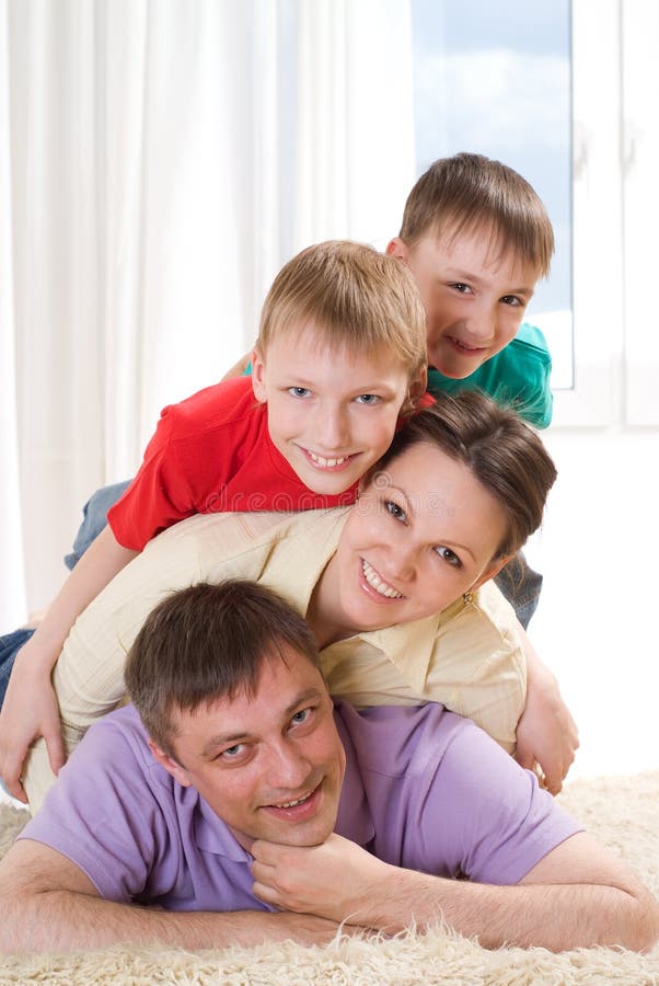Parents with Their Two Children Stock Photo - Image of couple, emotions ...