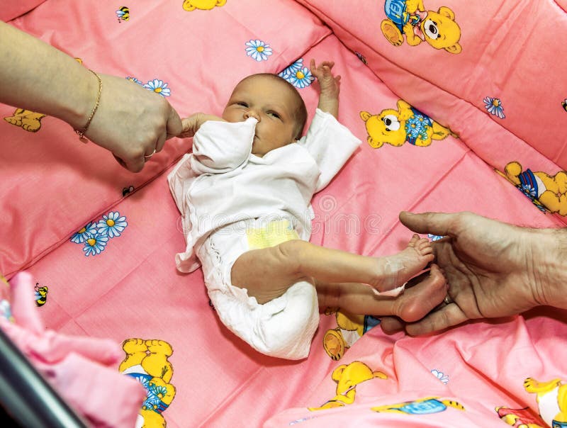 Parents Touch Her Newborn Child at the Crib Stock Image - Image of ...