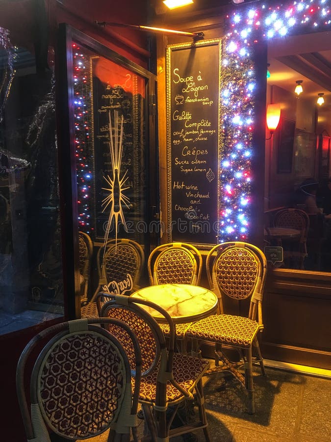 Paris Cafe Table on a Winter Night, with Menu Chalked on a Board ...