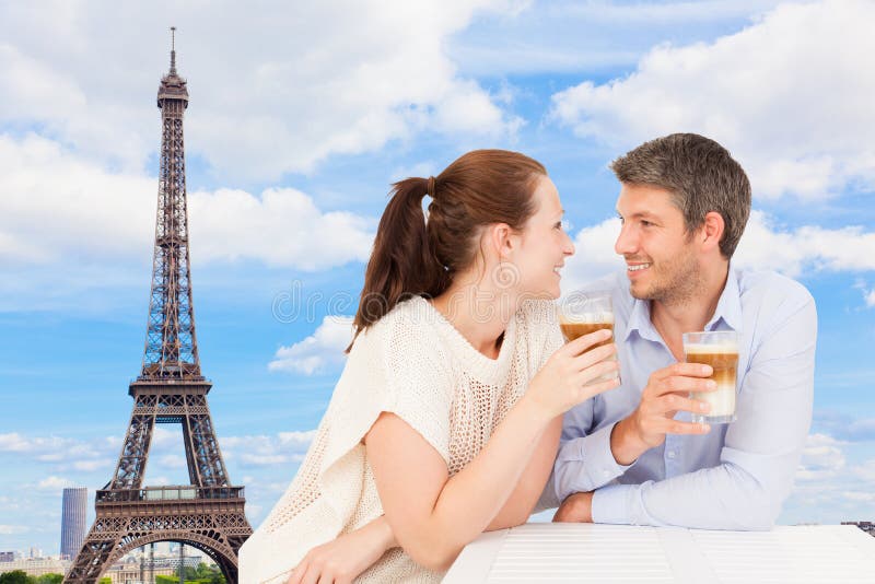 Happy Couple Drinking Cocktails While Relaxing On Their Deck Chairs ...