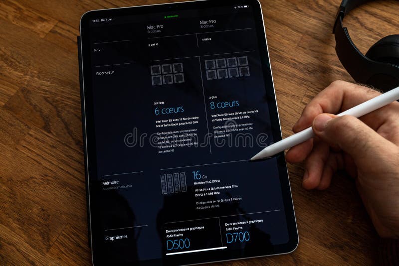 Man Reading IPad Pro about Mac Pro Trash Can Workstation Editorial ...