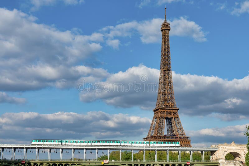 Paris Metro Crossing Iconic Steel Bridge with Eiffel Tower Background ...