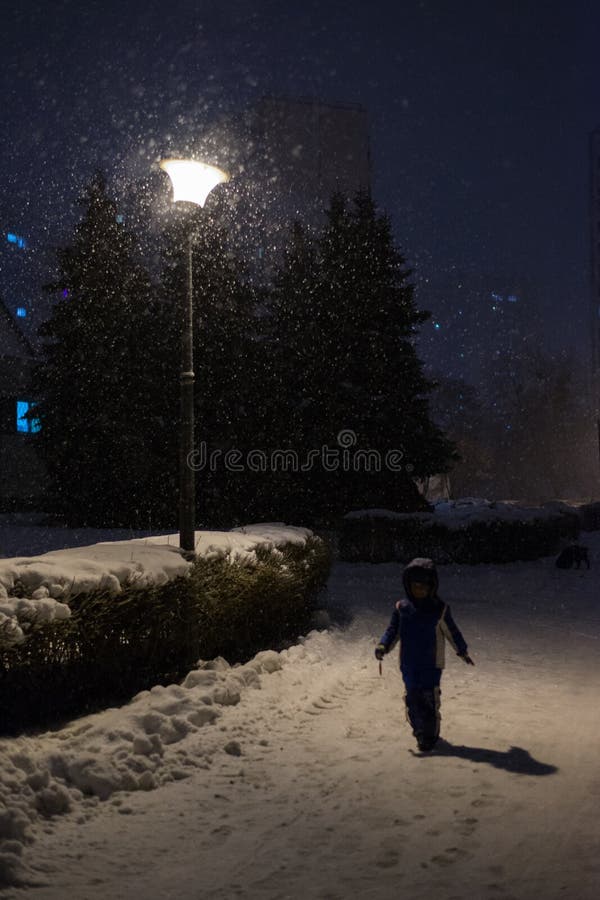Park Alley with Falling Snow at Night Stock Photo - Image of child ...