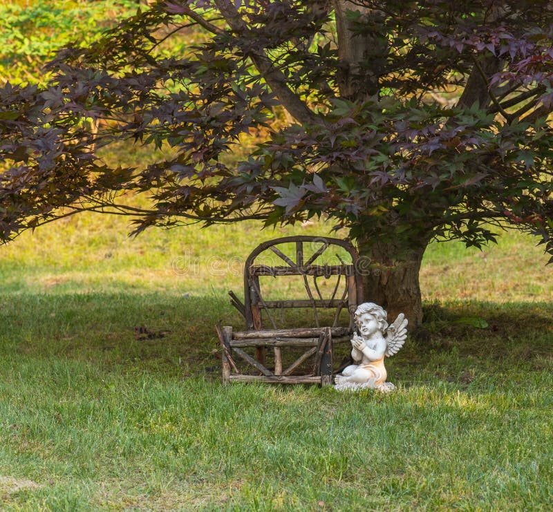 Park Bench and Angel stock image. Image of tree, light - 24984567