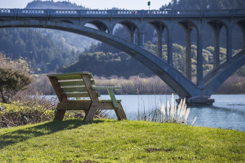 Park Bench Facing the Water Stock Photo - Image of beach, river: 173569200