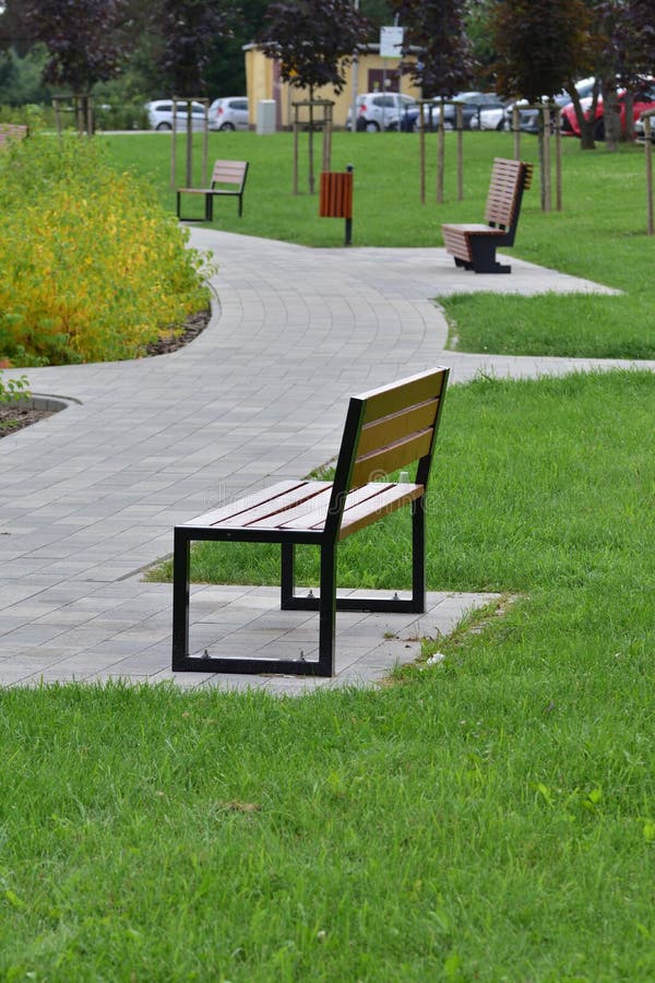 Park Bench by a Pedestrian Path on a Cloudy Day. Rest. Day Stock Photo ...