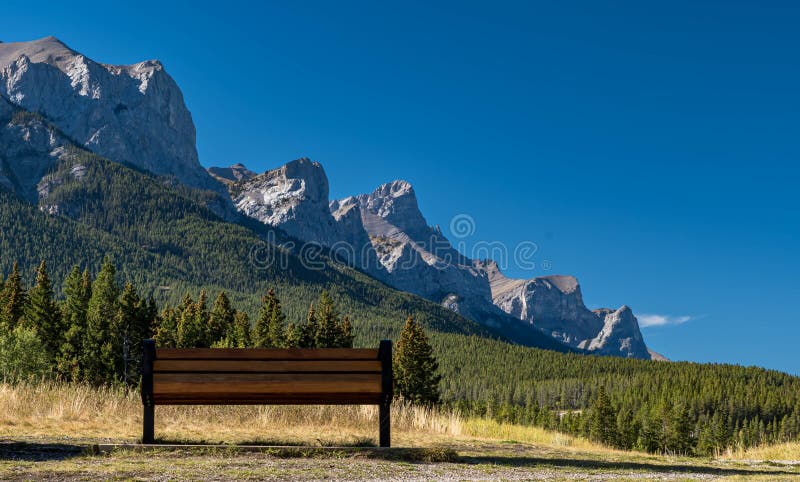 A Park Bench with a View of Mountains in Canmore, Alberta, Canada Stock ...
