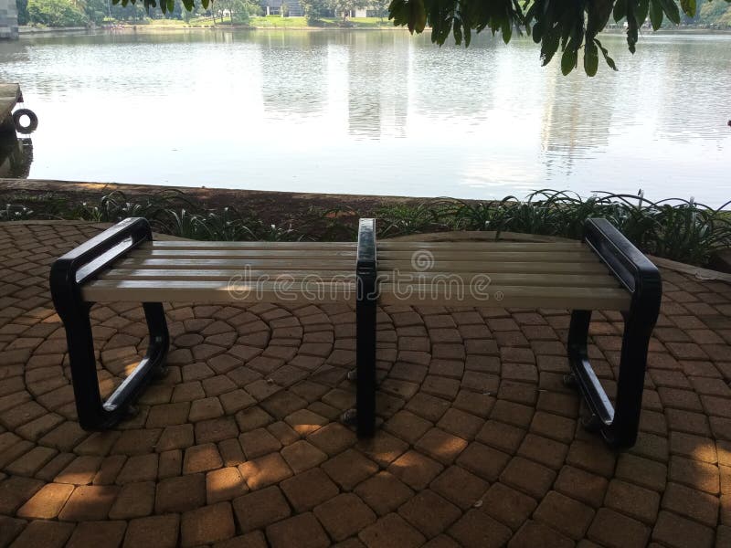 The Park Benches Around the Lake in the Campus Area Stock Image - Image ...