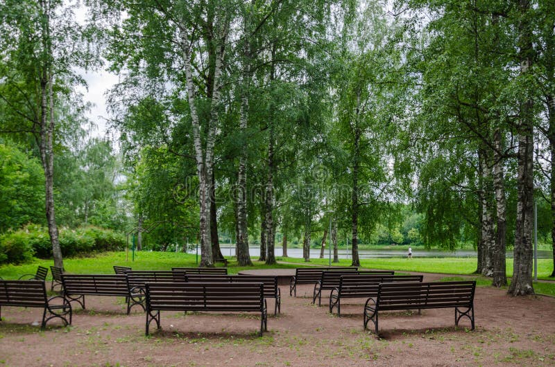 Park Benches in Front of a Street Stage Stock Photo - Image of bench ...