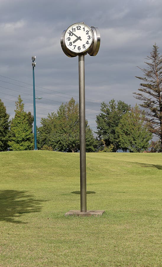 The clock in the park stock image. Image of grass, relax - 137688927