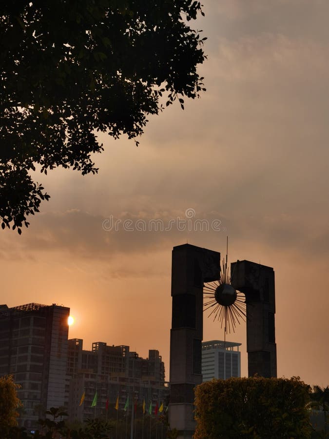 Park Featuring a Unique Clock Structure at Sunset in Longgang District ...