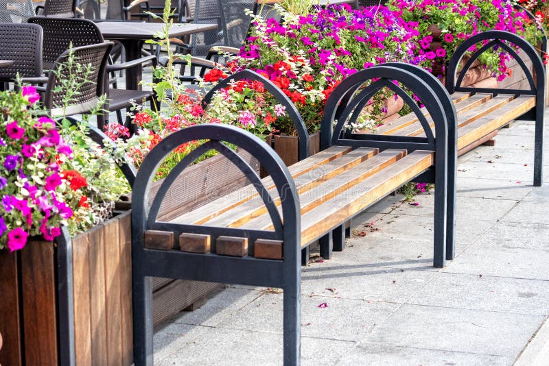 A Park with Flowers and a Rest Area with a Bench Stock Photo - Image of ...