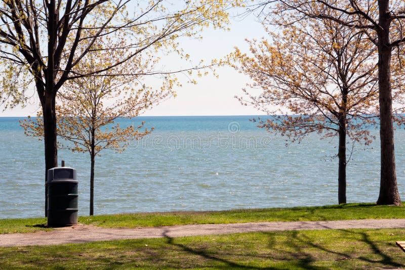 Park by Large Lake with Garbage Bin Stock Photo - Image of sunny, dump ...