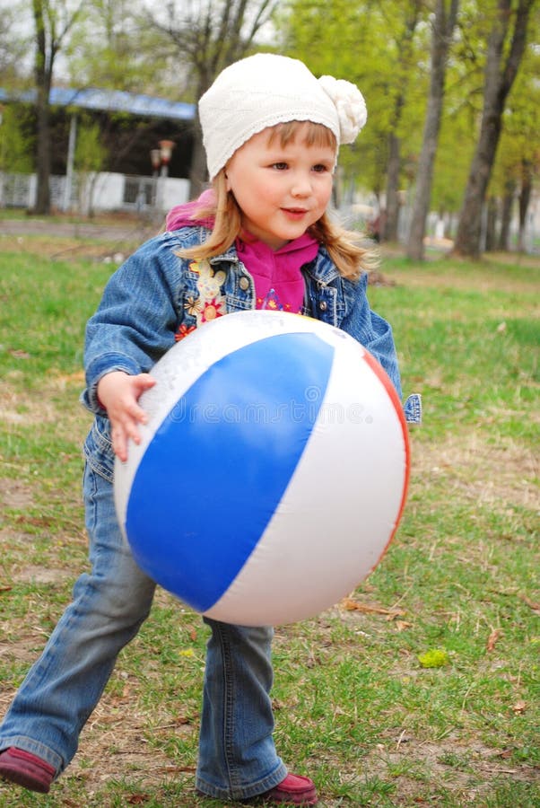 In the Park Little Girl Playing with a Ball. Stock Image - Image of ...