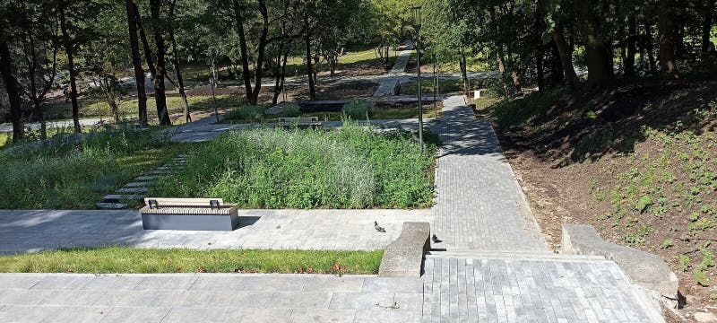 A Park with Paths Laid Out with Tiles that Go Down Stock Image - Image ...