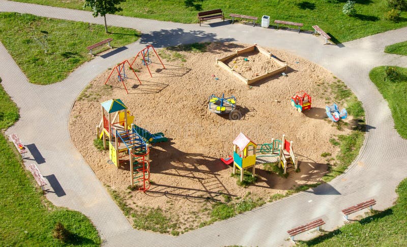 A Park with a Playground and Benches Stock Photo - Image of slide ...