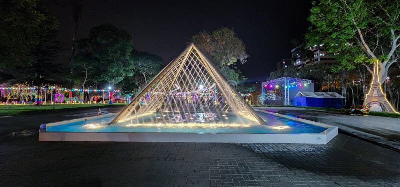Park with Pyramid-style Water Fountains with Night Lighting Editorial ...