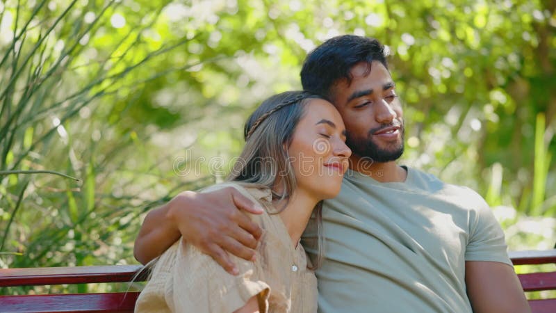 Park Relax And Happy Interracial Couple On Bench For Bonding Quality