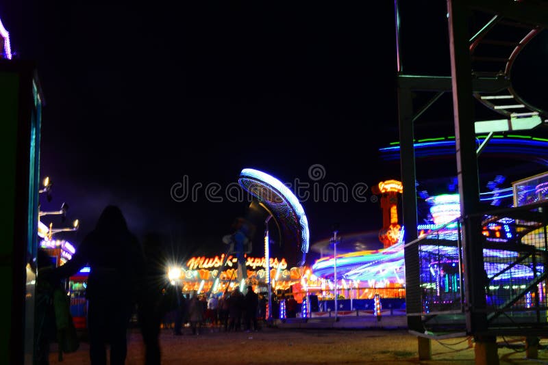 Park with rides at night editorial photo. Image of carousel - 204602846