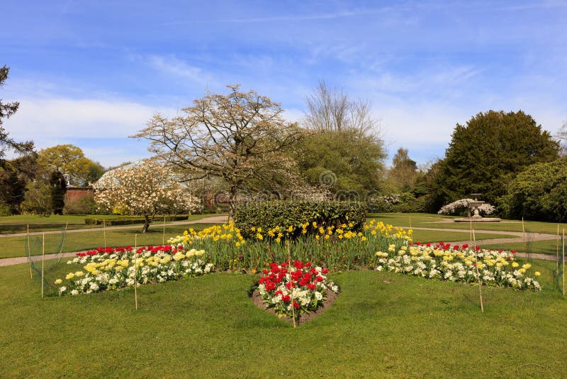 Park Scene with Flower Beds and Blossoming Trees. Stock Photo - Image ...