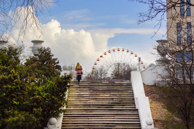 Park in Spring. Against the Backdrop of a Beautiful Staircase, a Ferris ...