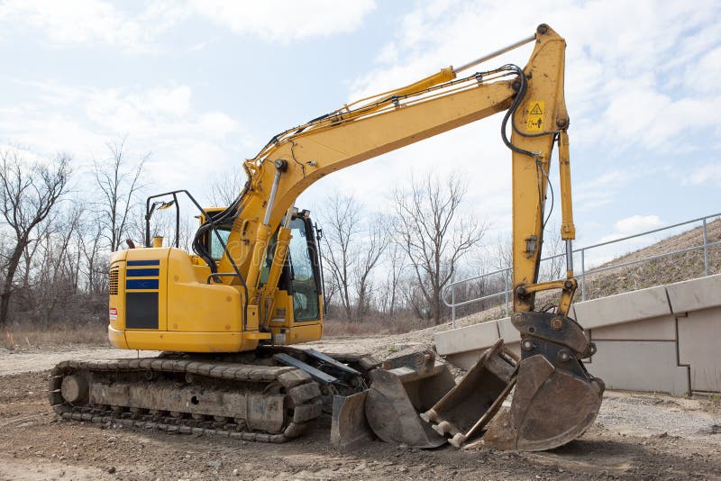 Parked Backhoe at Construction Site Stock Photo - Image of diggers ...