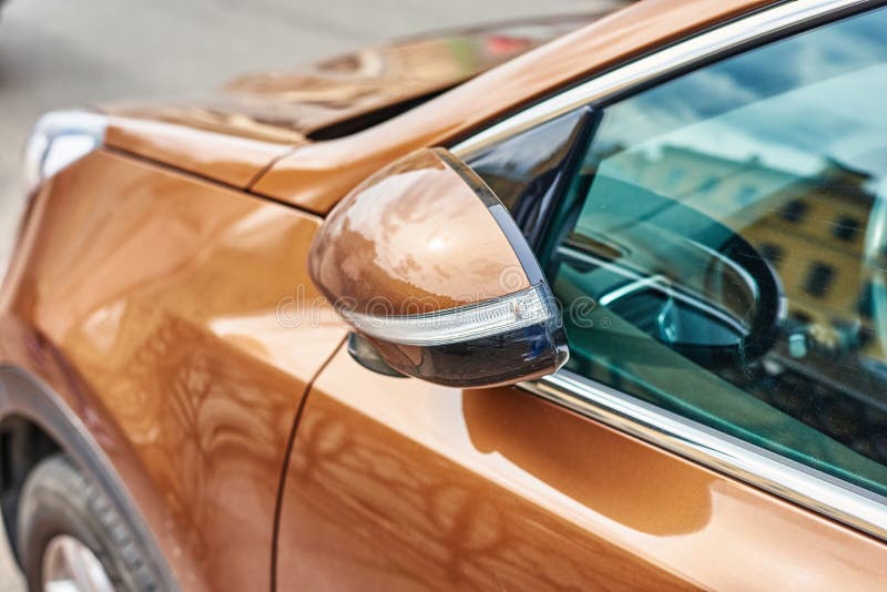 Parked Car with Automatic Folding Rear View Mirror Stock Photo - Image ...