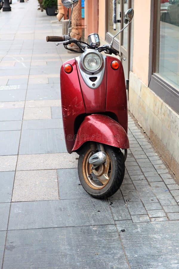 Red Moped Parked Near the Building Wall Stock Photo - Image of road ...
