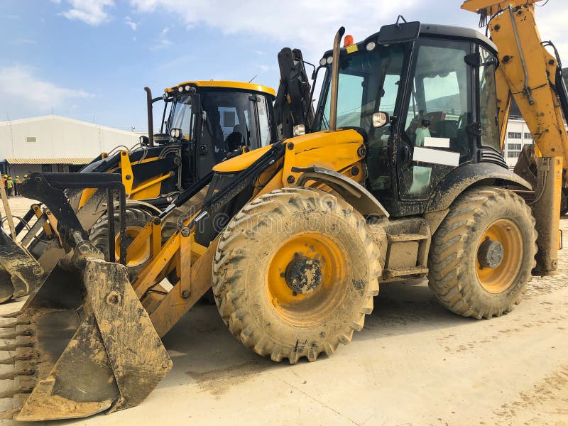 Parked Yellow Backhoe Loader. Earthmoving, Excavating, Digging ...