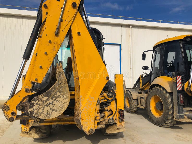 Parked Yellow Backhoe Loader. Earthmoving, Excavating, Digging ...