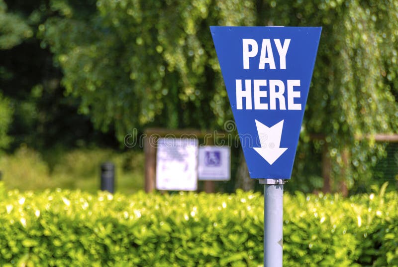 Parking Charge Pay Here Blue Sign Post in Green Environment Stock Photo ...