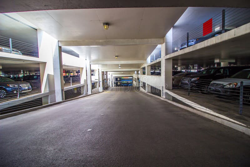 Ramp in Enclosed Parking Garage Stock Image - Image of exit, mirrors ...