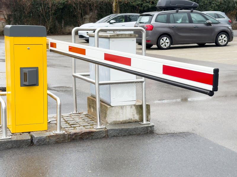 Parking Lot Barrier Gate with Red and White Stripes on a Rainy Day ...