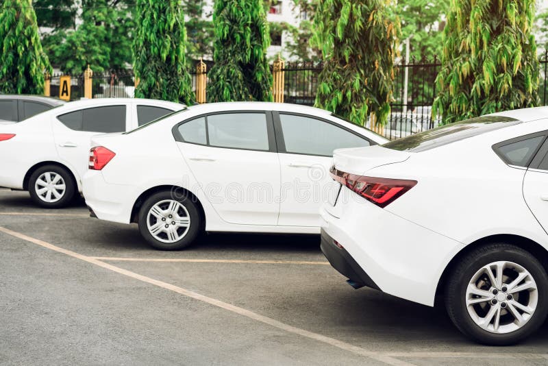 Parking Lot at the Open and There is a Parked Car. There are Trees ...