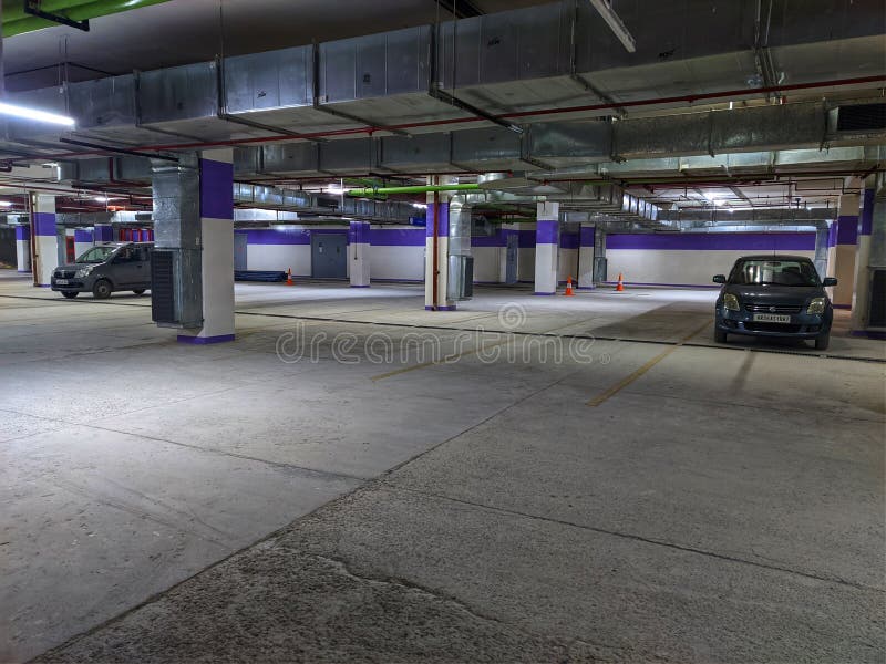 Parking lot with two cars editorial stock image. Image of parking ...