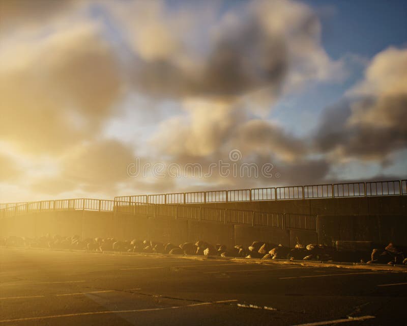 Parking with Promenade at Beach during Sunset with a Cloudy Sky. Stock ...