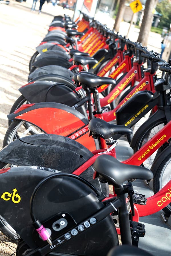 Parking for Rental Bikes in Central Washington. Row of Fixed Red Bikes ...